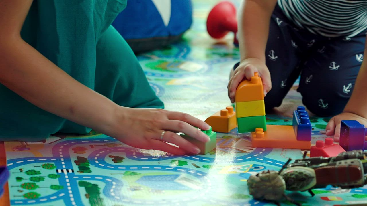 Mother and child building with blocks - Free Stock Video