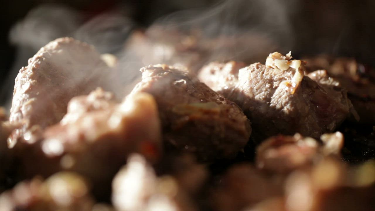 Steaming meat on a BBQ - Free Stock Video