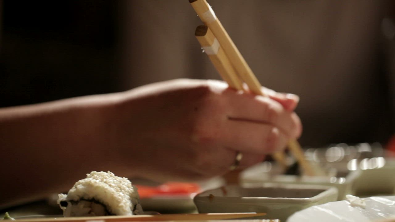 Eating Sushi in a restaurant - Free Stock Video