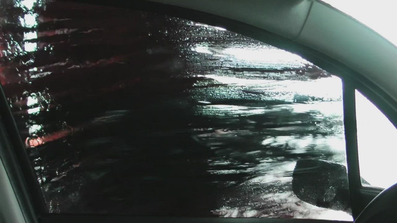 Car washing machine seen from inside the car - Free Stock Video