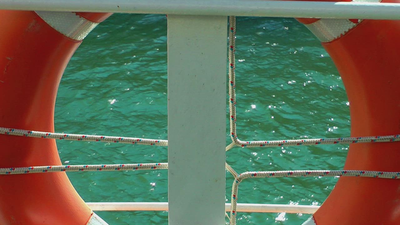 Seawater seen trough a lifeguard on a boat - Free Stock Video