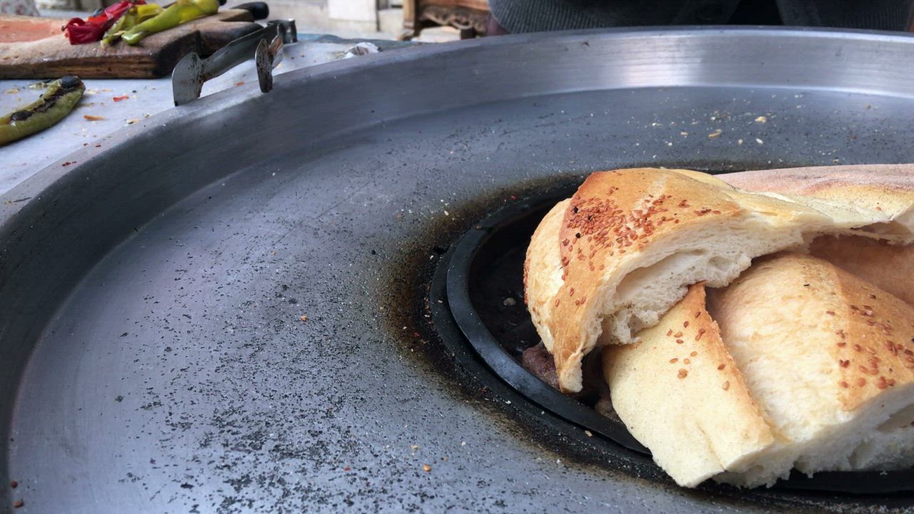 Person cooking beef with bread - Free Stock Video