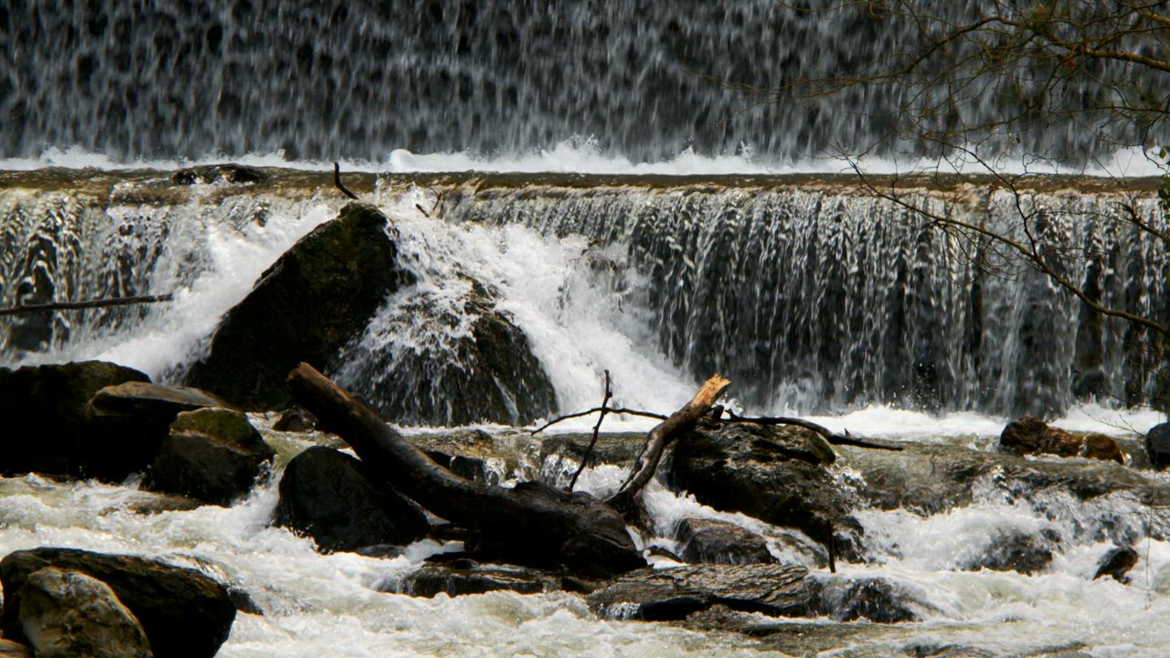Multi-level waterfalls in a river - Free Stock Video