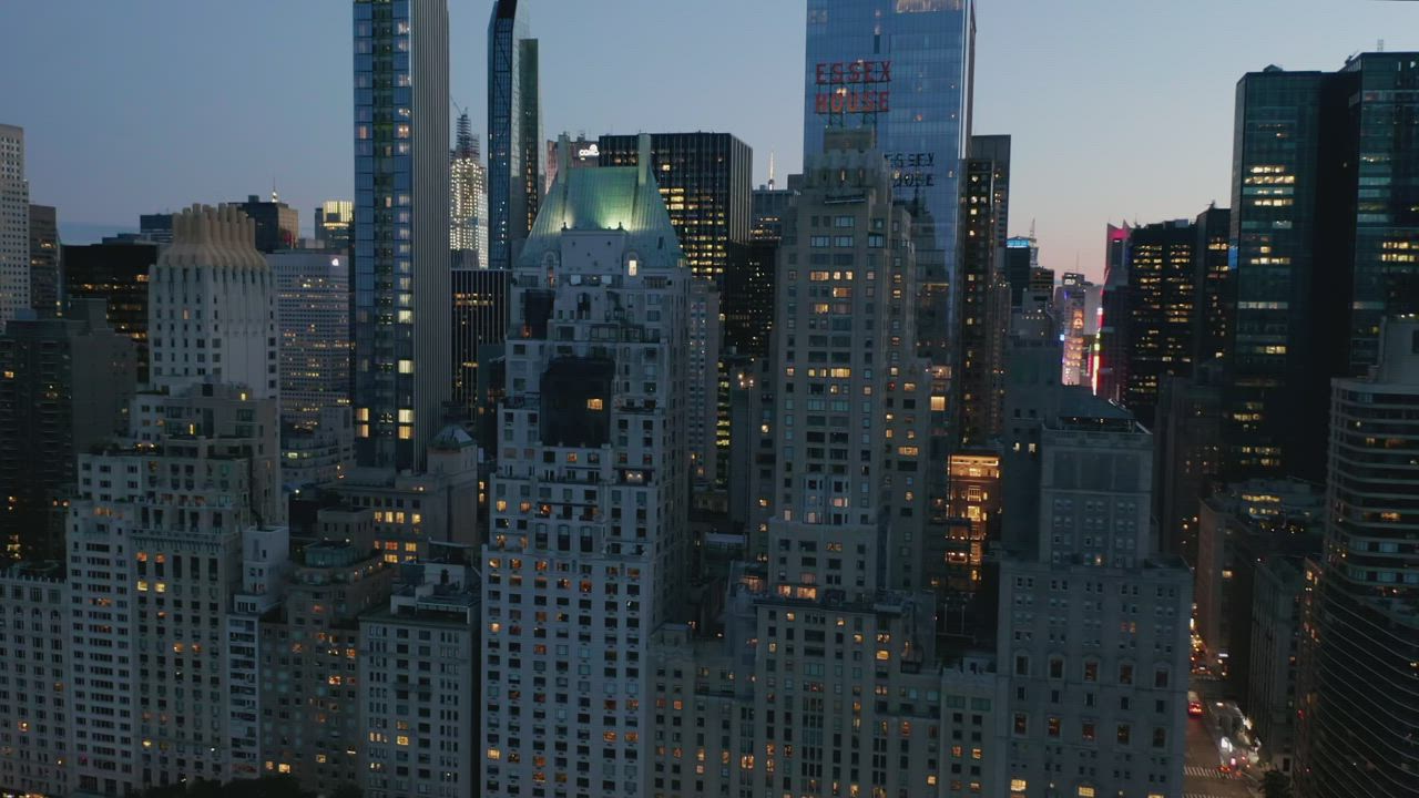 Zoom out aerial shot of Manhattan city at dusk - Free Stock Video