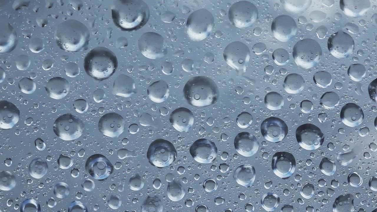 Texture of water drops vibrating on a glass - Free Stock Video