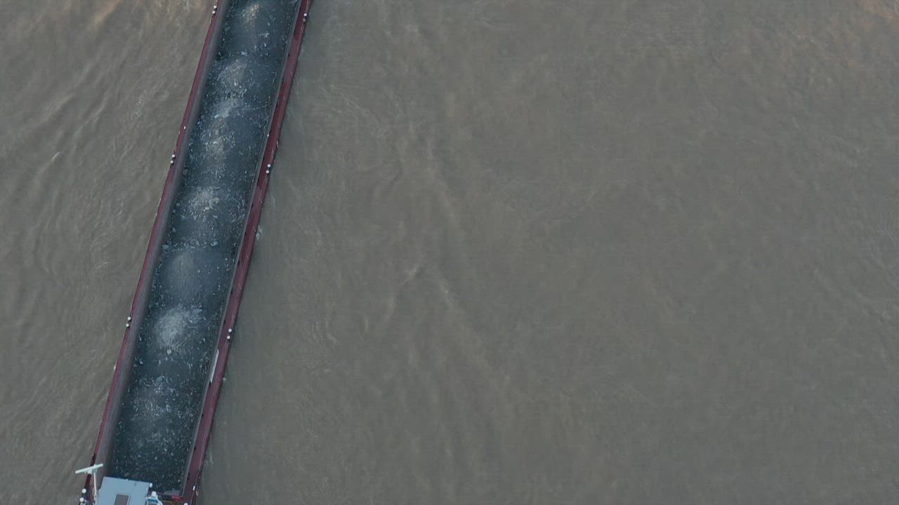 Cargo ship in the river near a bridge - Free Stock Video