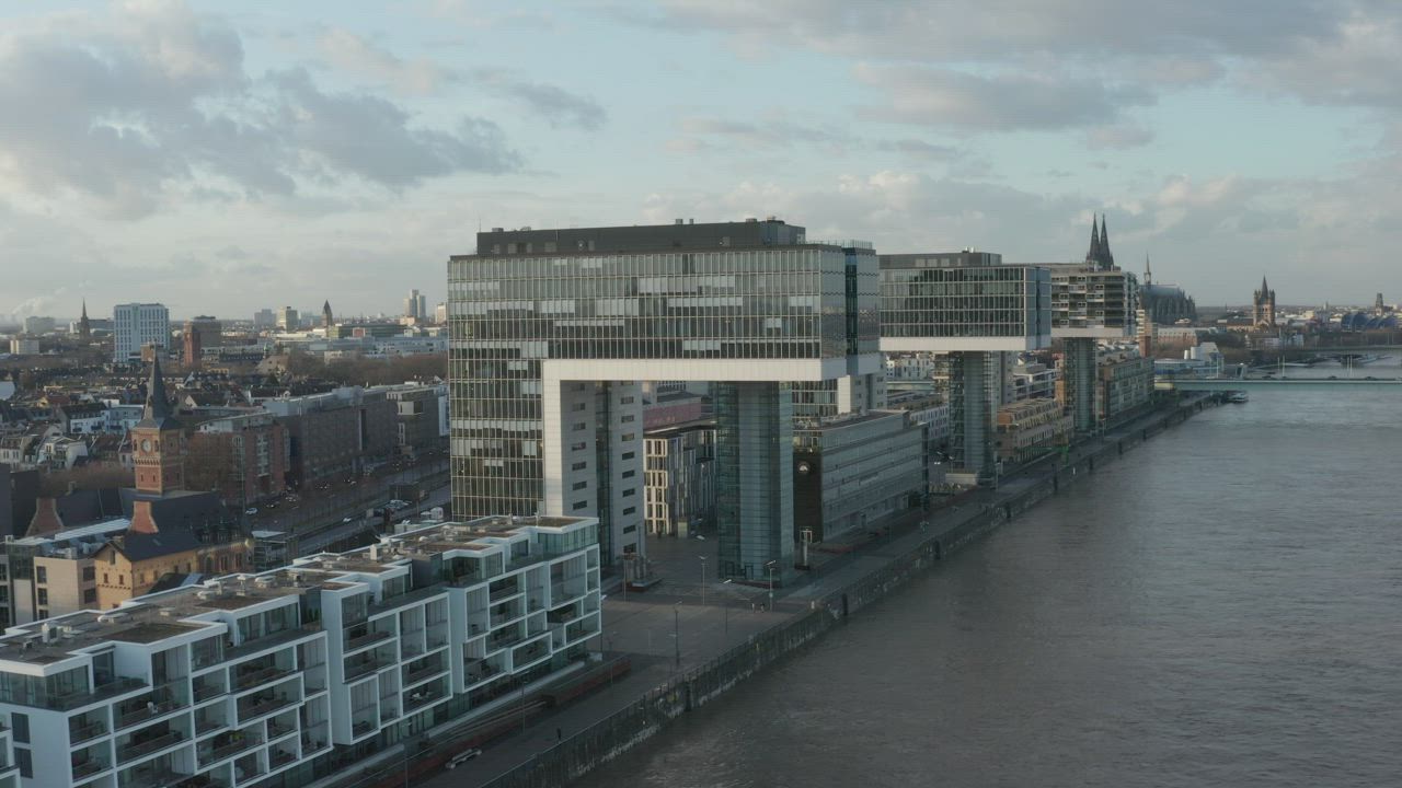 Buildings with modern architecture by the river - Free Stock Video