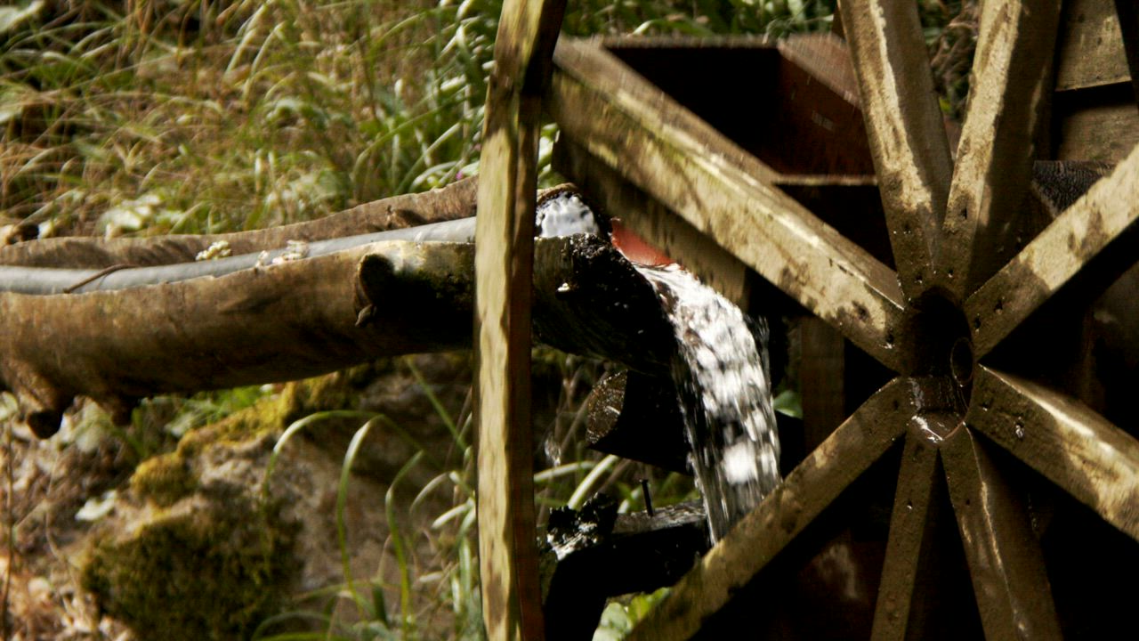 Watermill in the middle of nature, closely seen - Free Stock Video