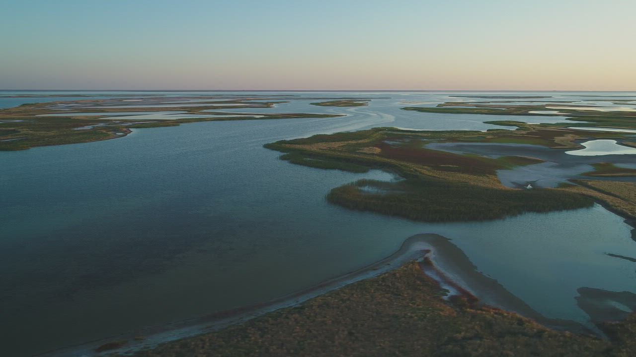 Aerial view of a lake with unusual islands - Free Stock Video