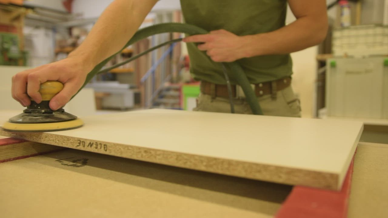 Carpenter sanding a table seen close - Free Stock Video