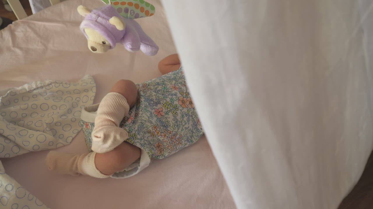 Restless baby in bed - Free Stock Video