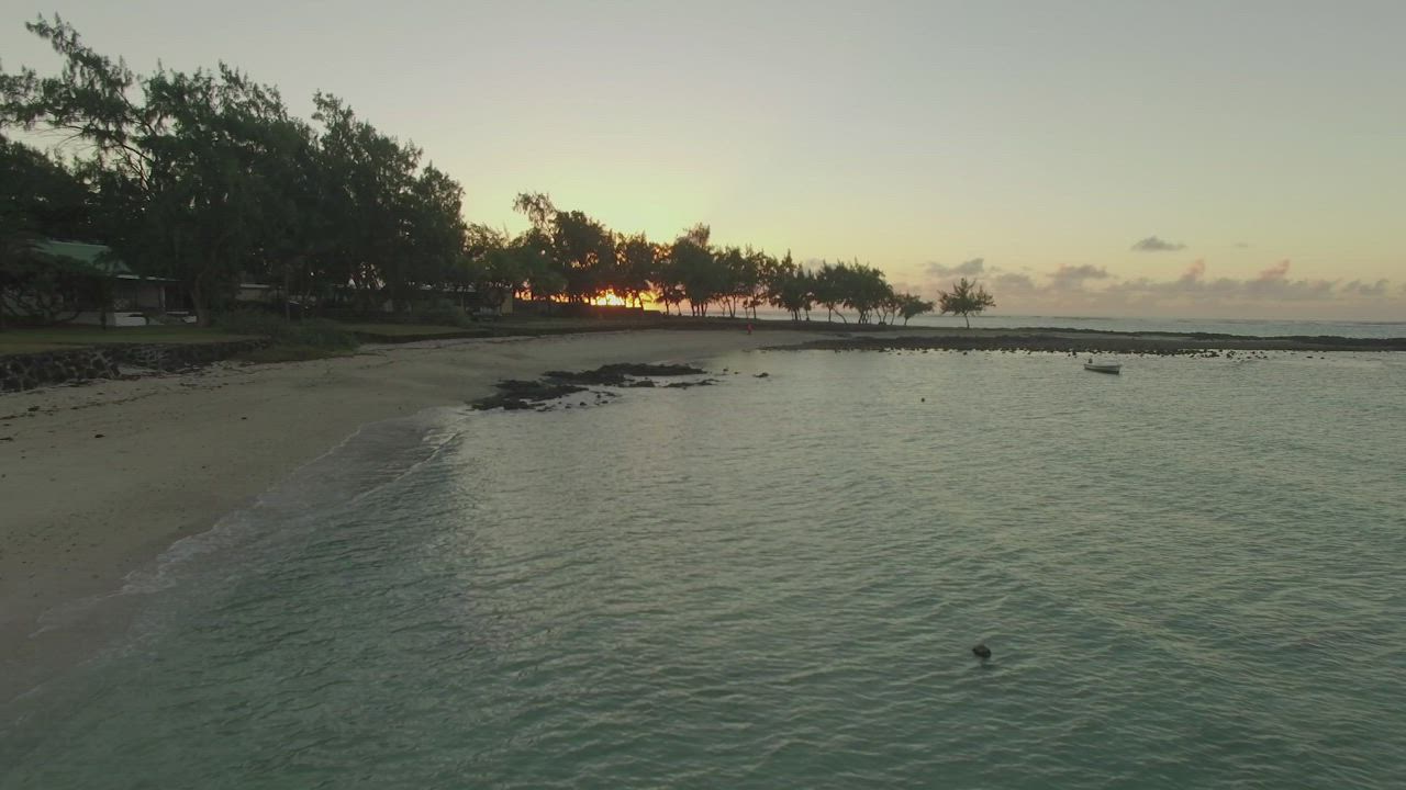 Sunset at the edge of an island - Free Stock Video