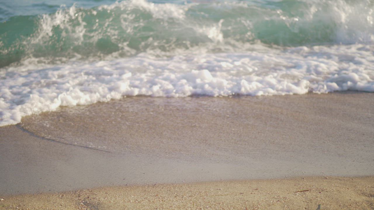 Waves rolling over sand - Free Stock Video