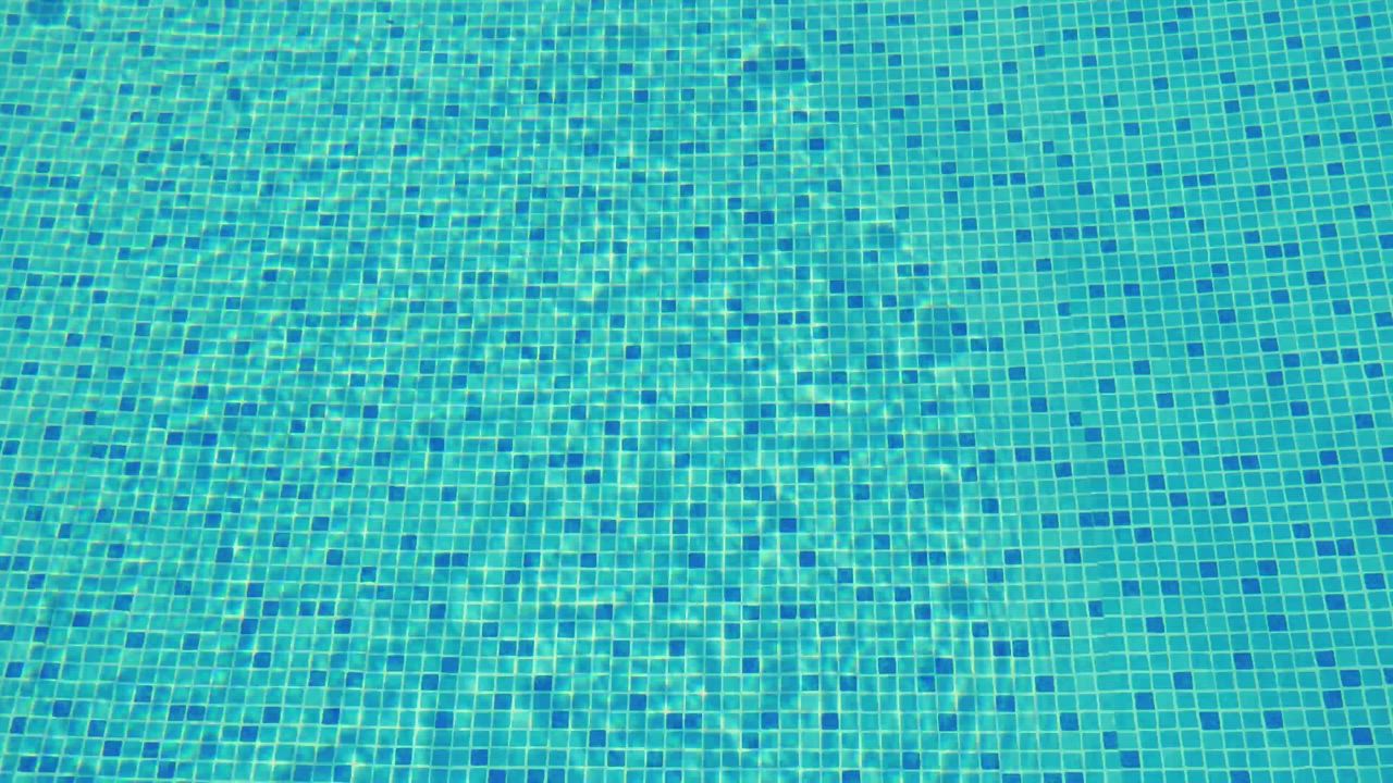 Clear pool water with a gentle ripple - Free Stock Video