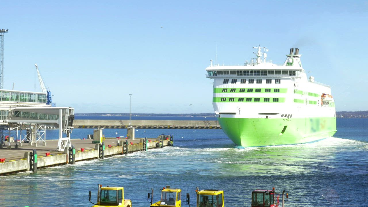 Green ship leaving port - Free Stock Video