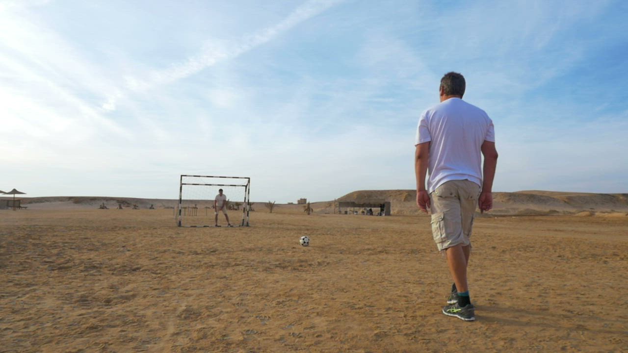 Man scoring a goal against his son - Free Stock Video