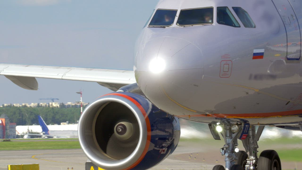 Aircraft moving around an airport - Free Stock Video