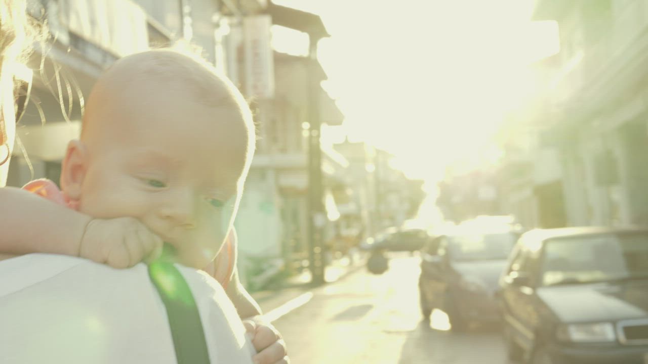 Mother and baby walking in the sun - Free Stock Video