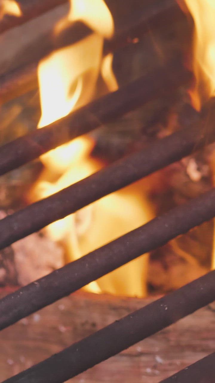 Flames burning inside a BBQ grill - Free Stock Video
