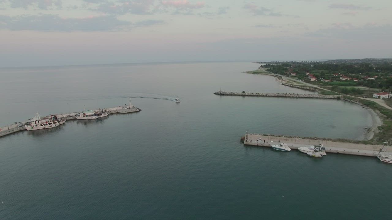 Boats anchored in a tiny harbor - Free Stock Video