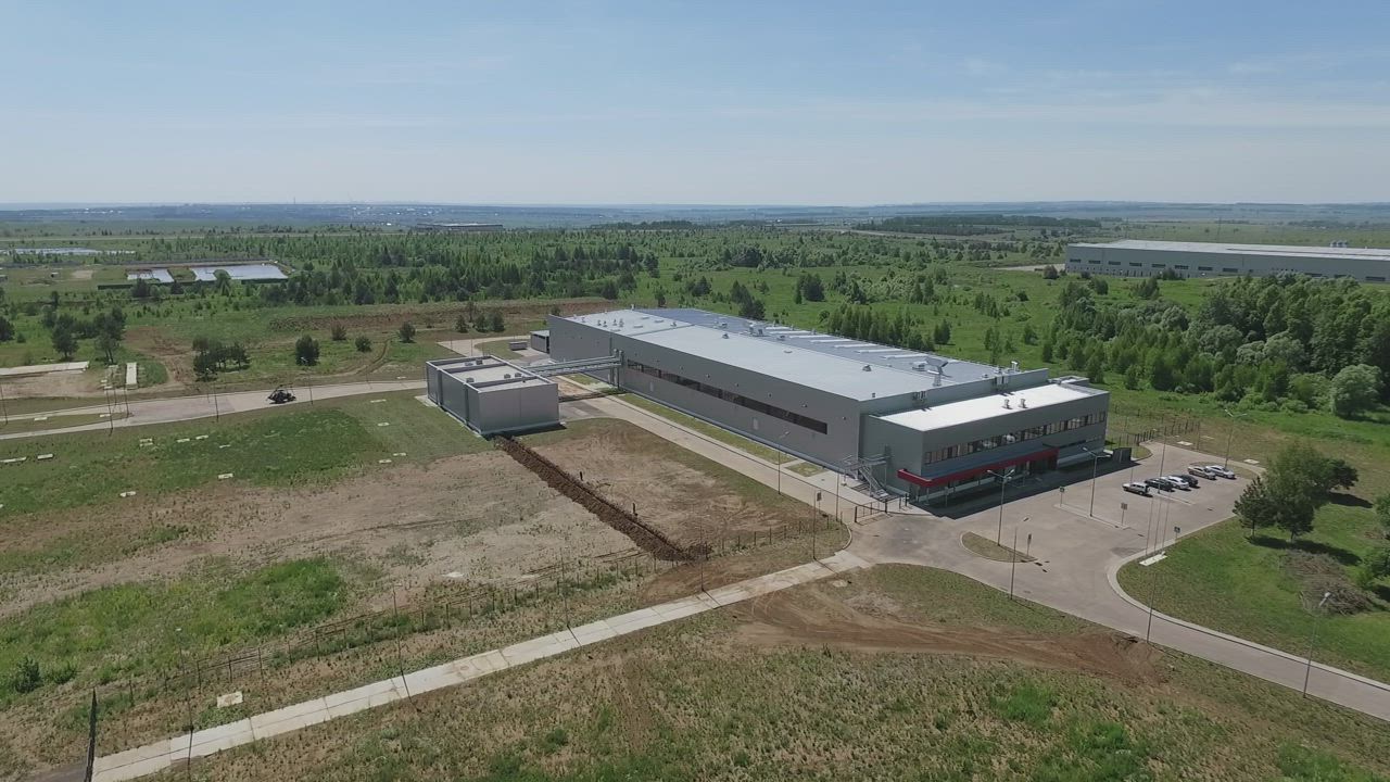 Modern factory outside the city - Free Stock Video