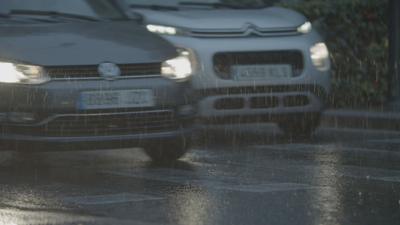 Cars driving through rainfall - Free Stock Video
