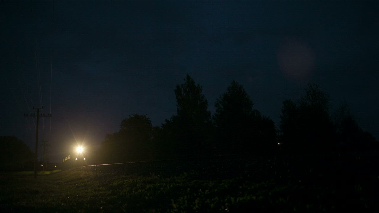 Night train heading through the countryside - Free Stock Video