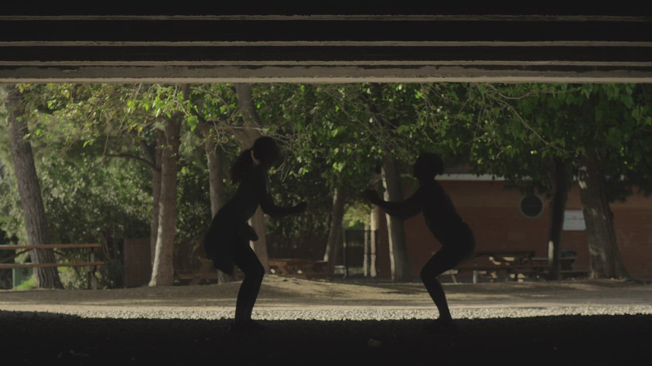 Working out under a bridge - Free Stock Video