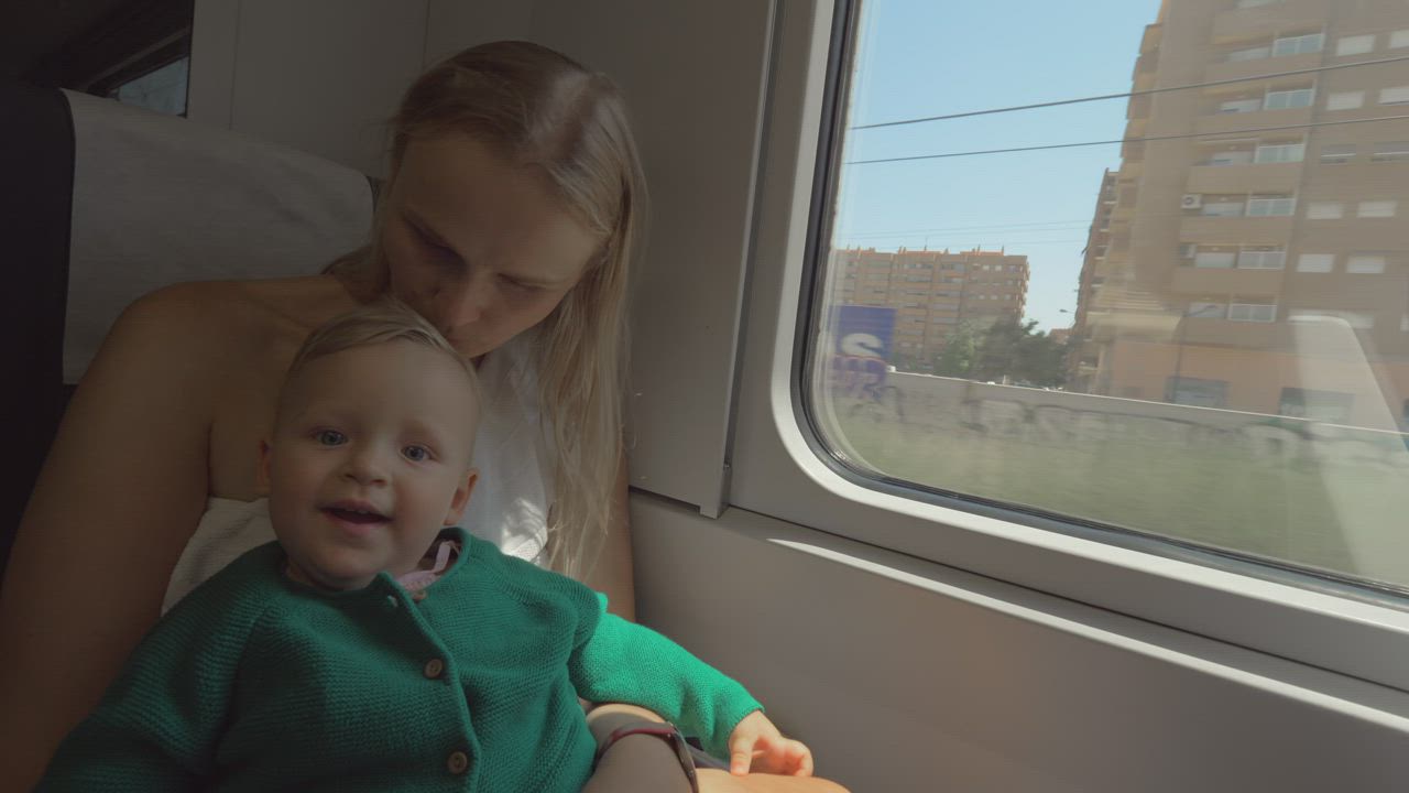 Baby enjoying a train journey - Free Stock Video