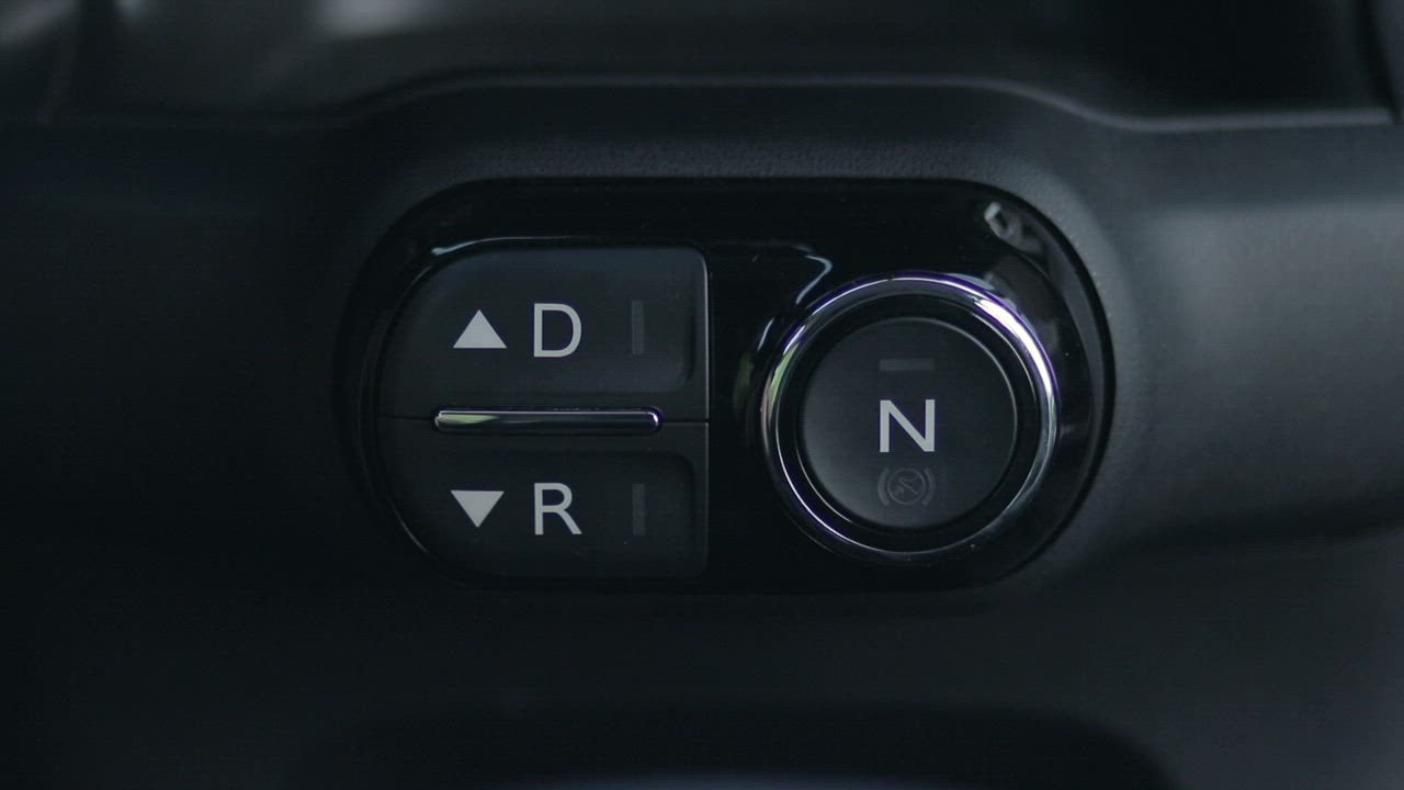 Woman pressing the reverse button on a dashboard - Free Stock Video
