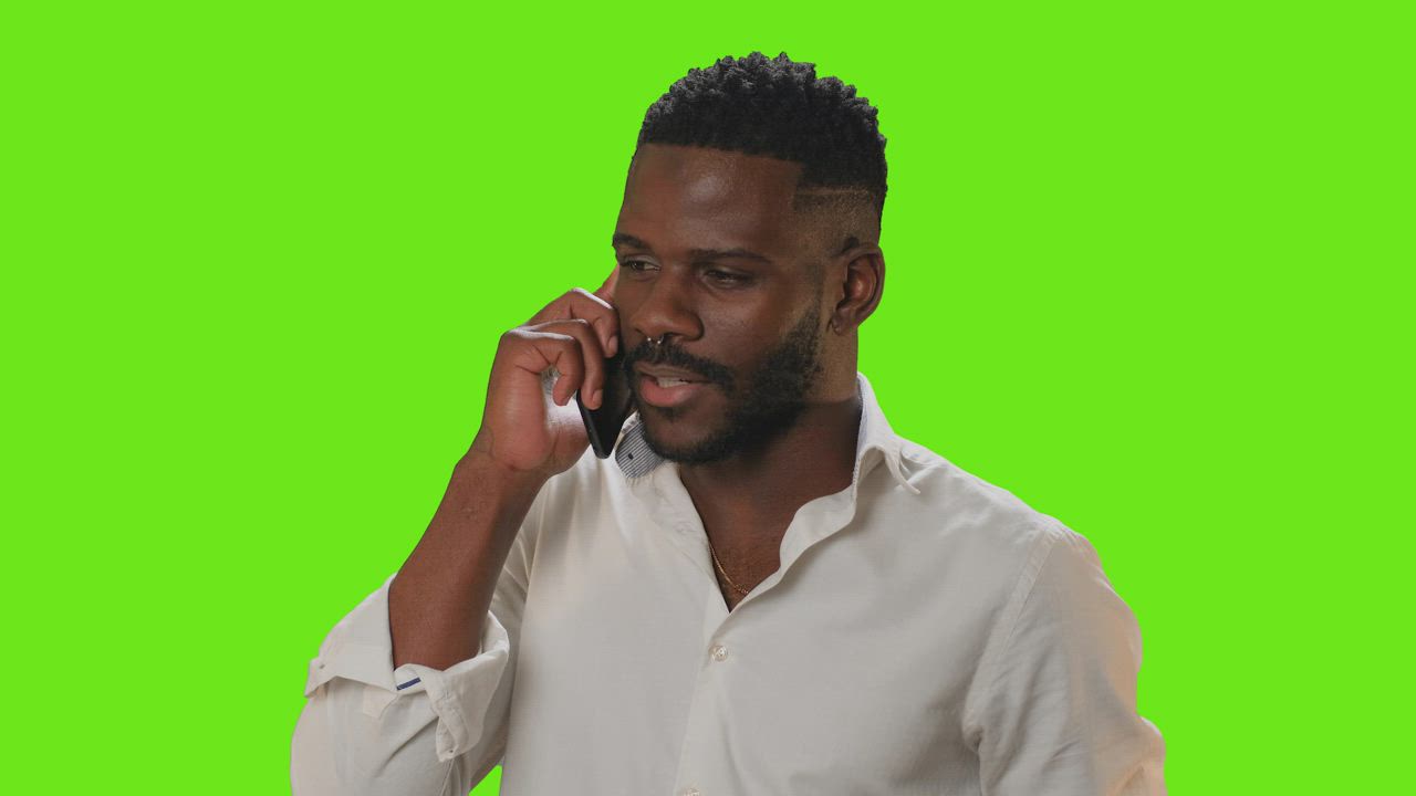 Man on a green screen on a phone call - Free Stock Video