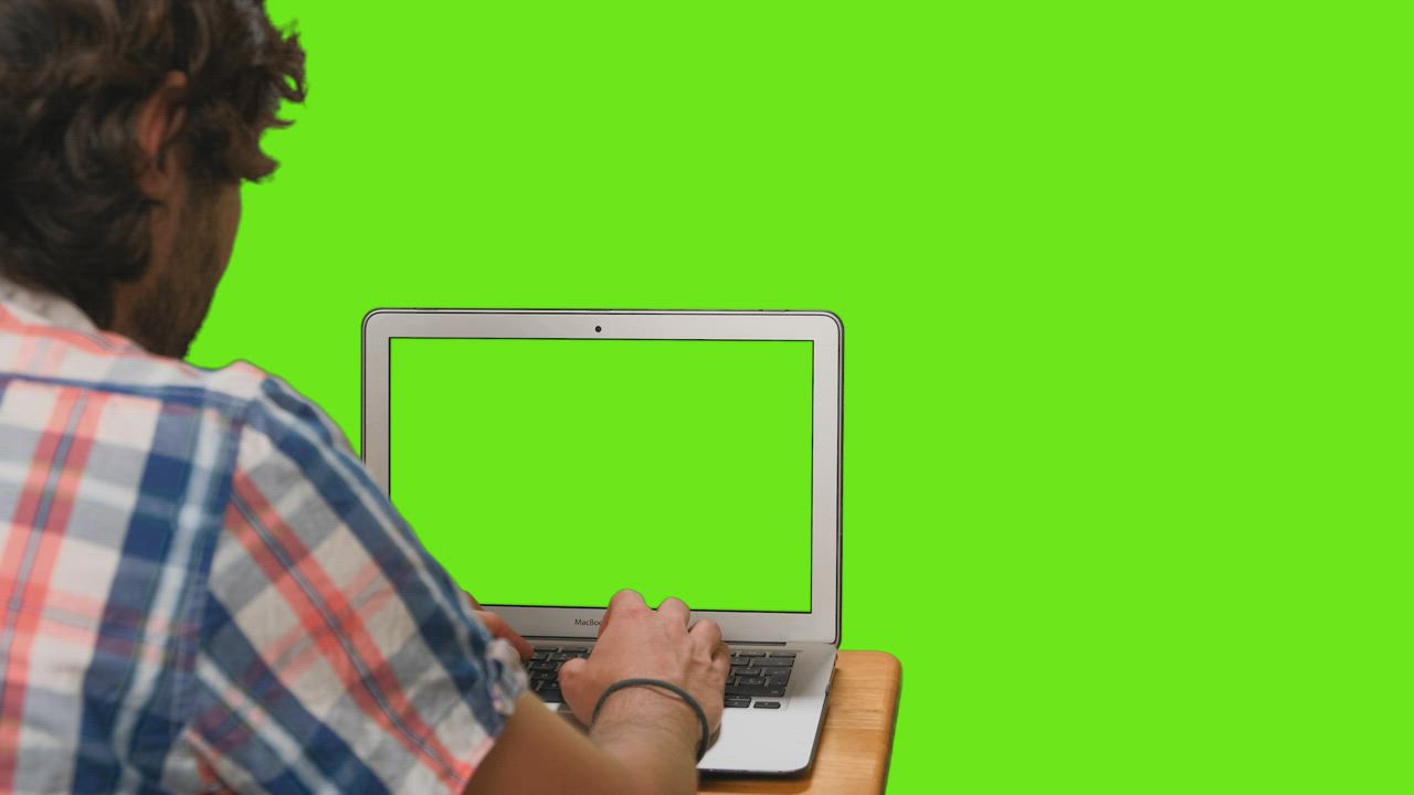 Boy on his computer with green screen on a chroma background - Free ...