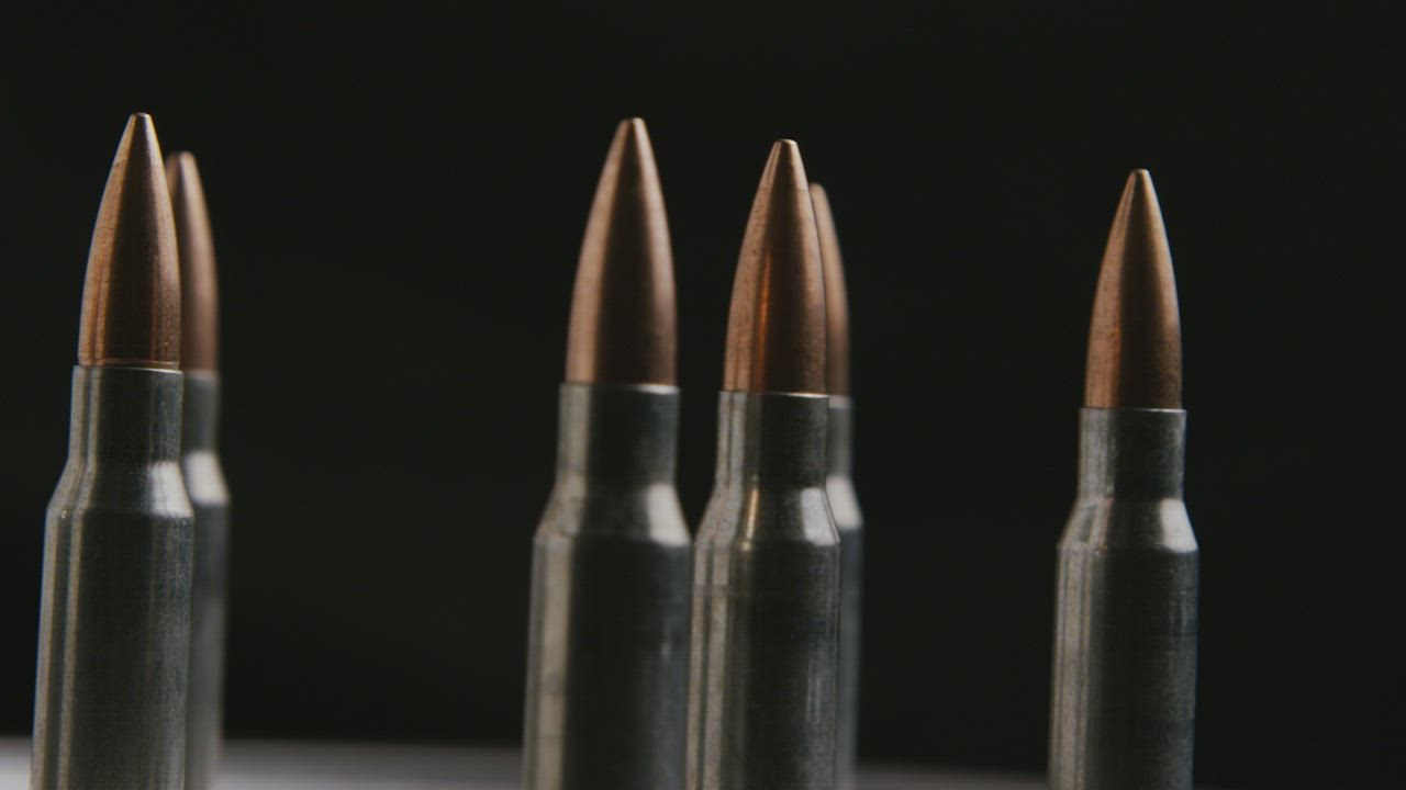 Big bullets rotating on a black background - Free Stock Video