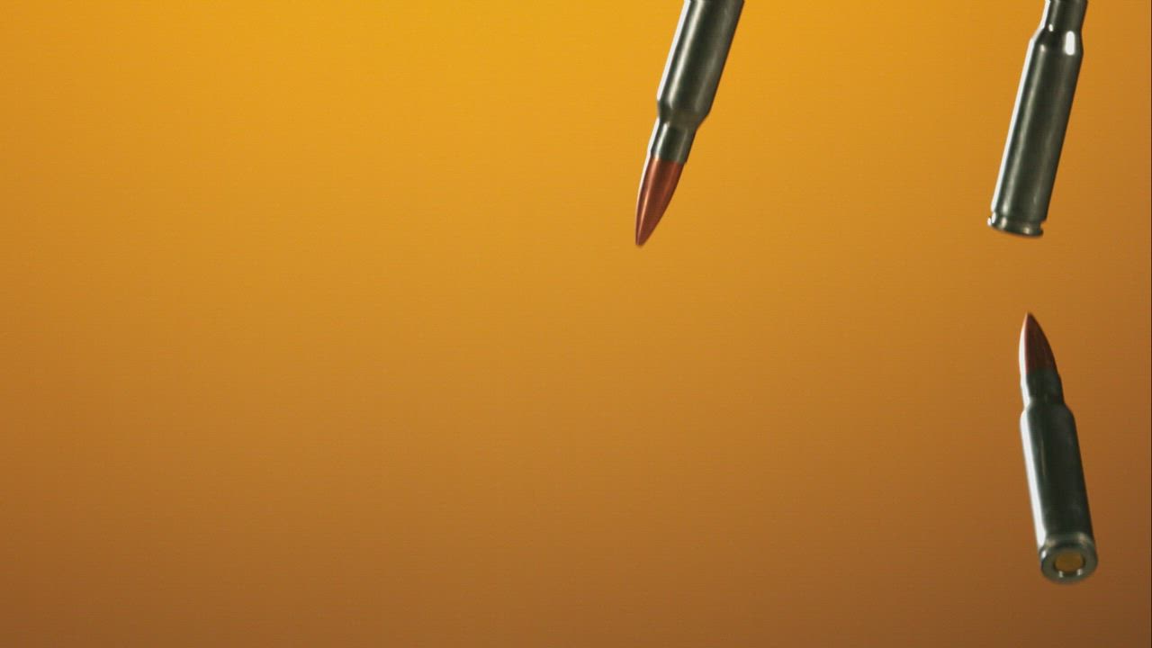 Big bullets falling and bouncing - Free Stock Video