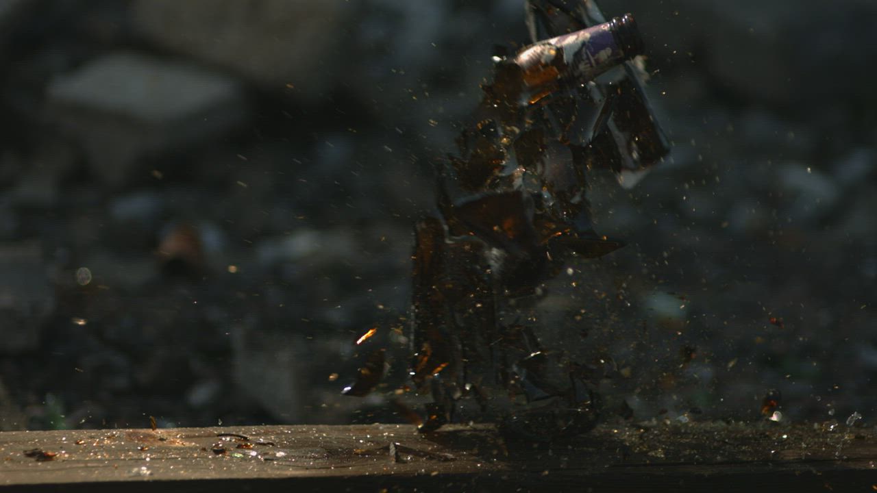 Glass bottle breaking in slow motion - Free Stock Video