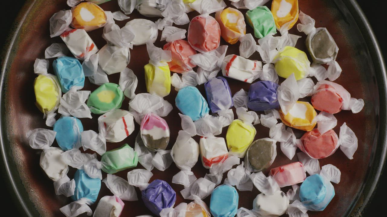 Multicolor candies in a plate rotating - Free Stock Video