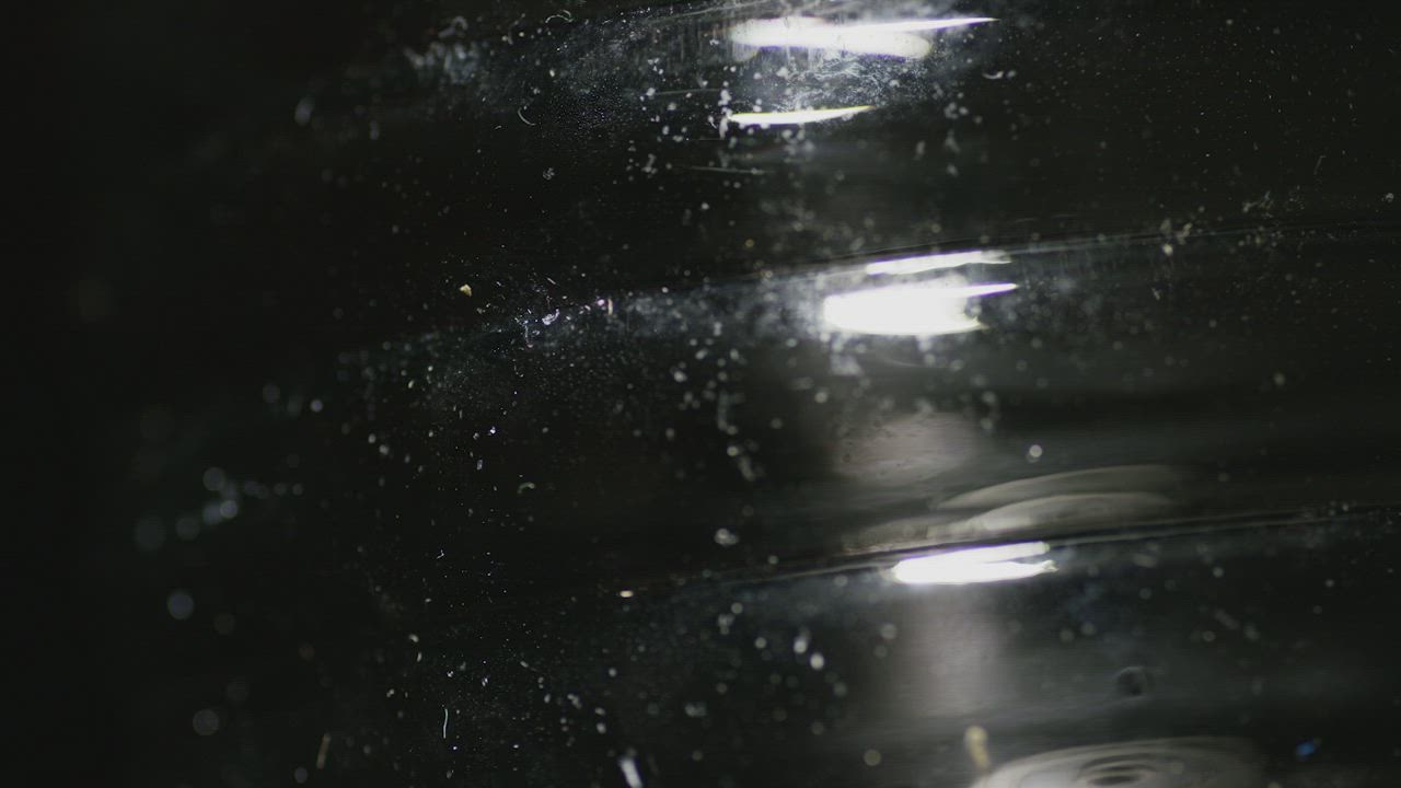 Light reflection on black surface - Free Stock Video