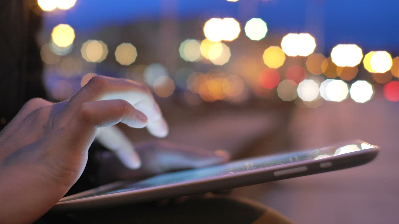 Woman using a tablet outdoors - Free Stock Video