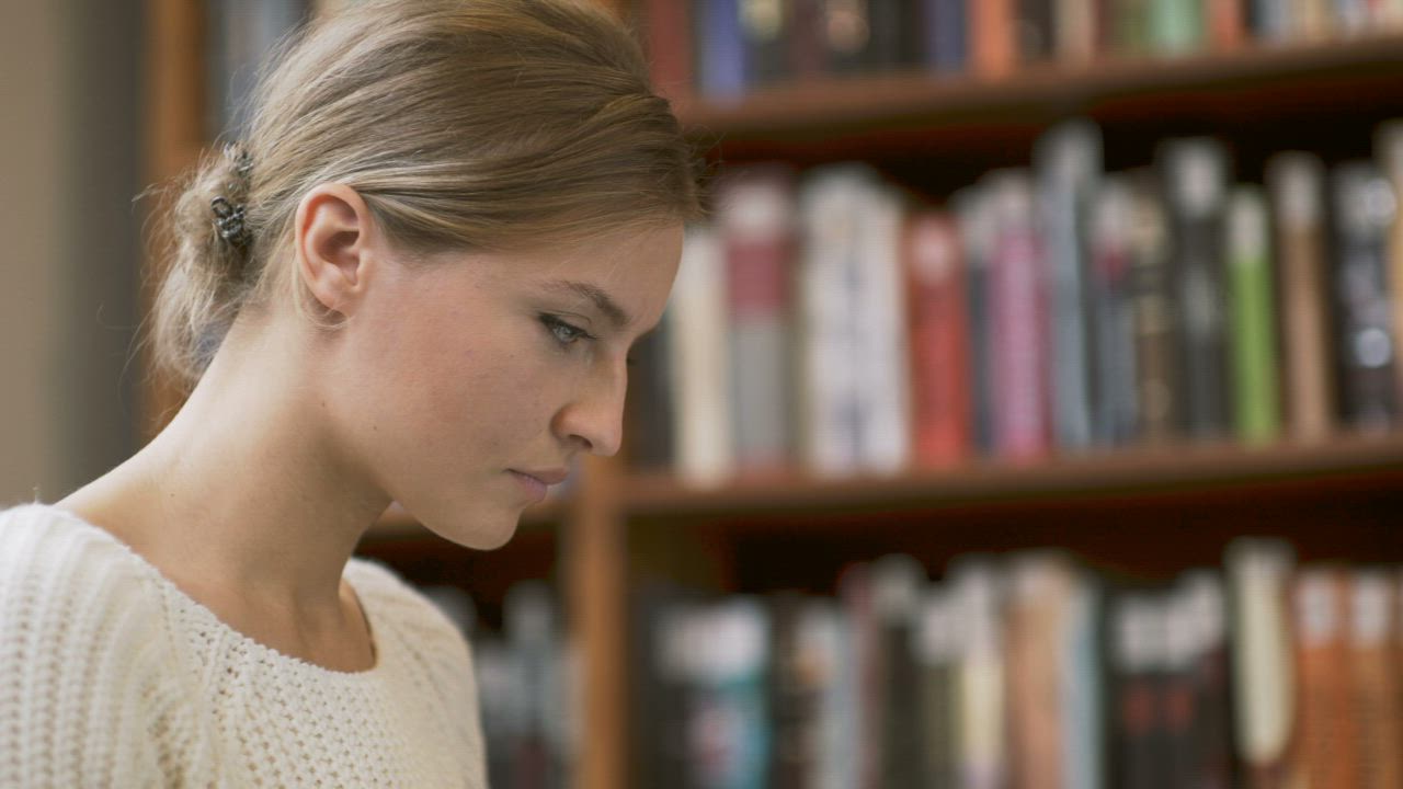 Close up of a focused woman - Free Stock Video