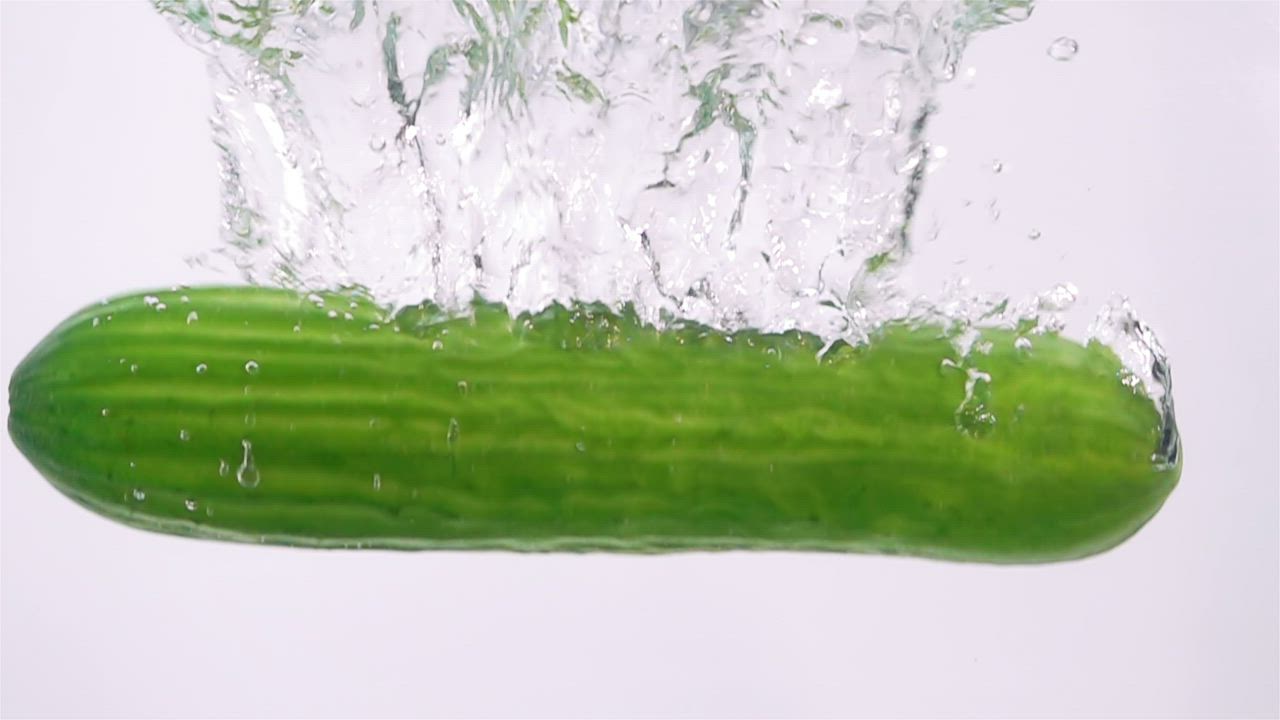 Cucumber falling through water - Free Stock Video