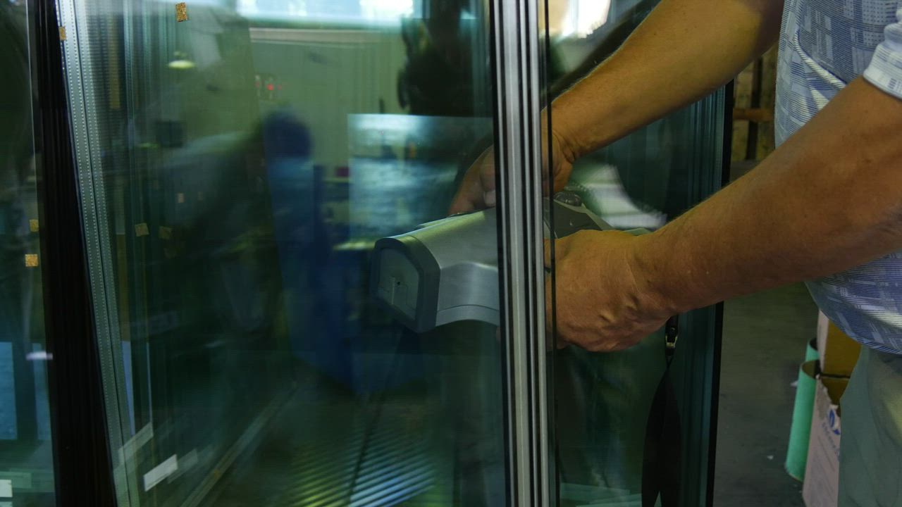 Worker holding a measurement tool - Free Stock Video