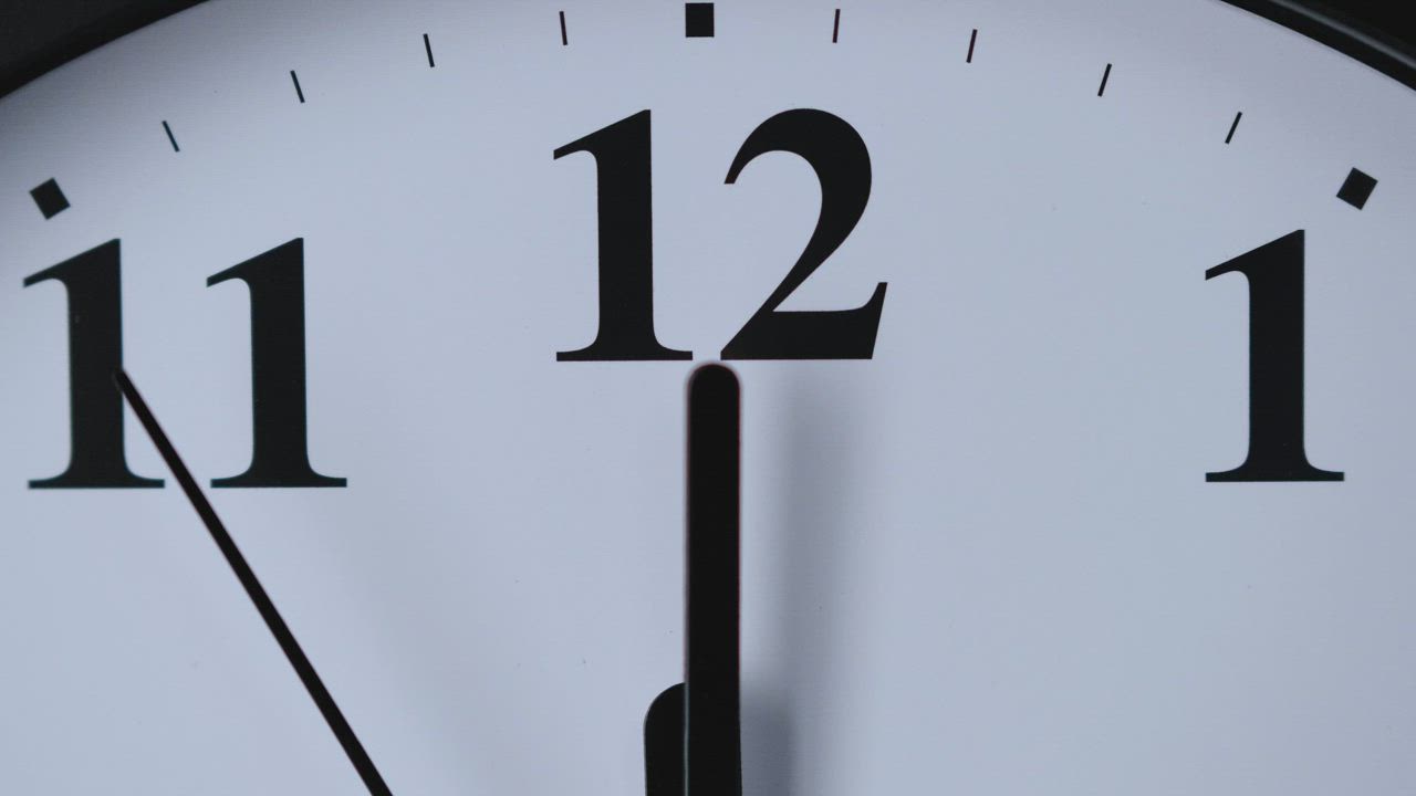 Top of a wall clock in a close-up shot - Free Stock Video