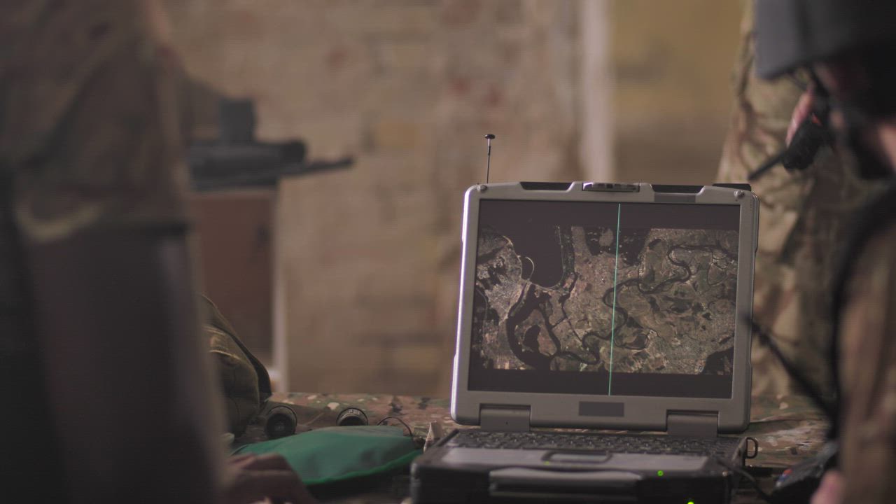 Soldiers looking at a map - Free Stock Video