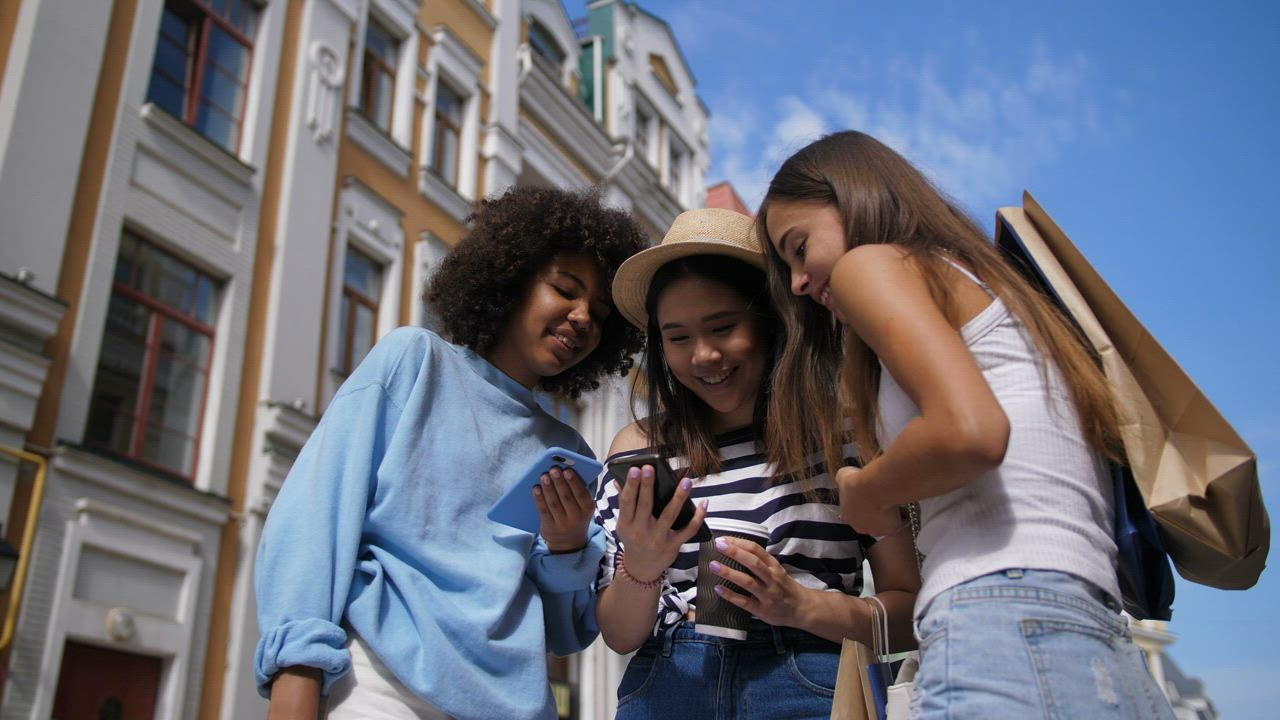 Girls checking text messages while out for the day - Free Stock Video