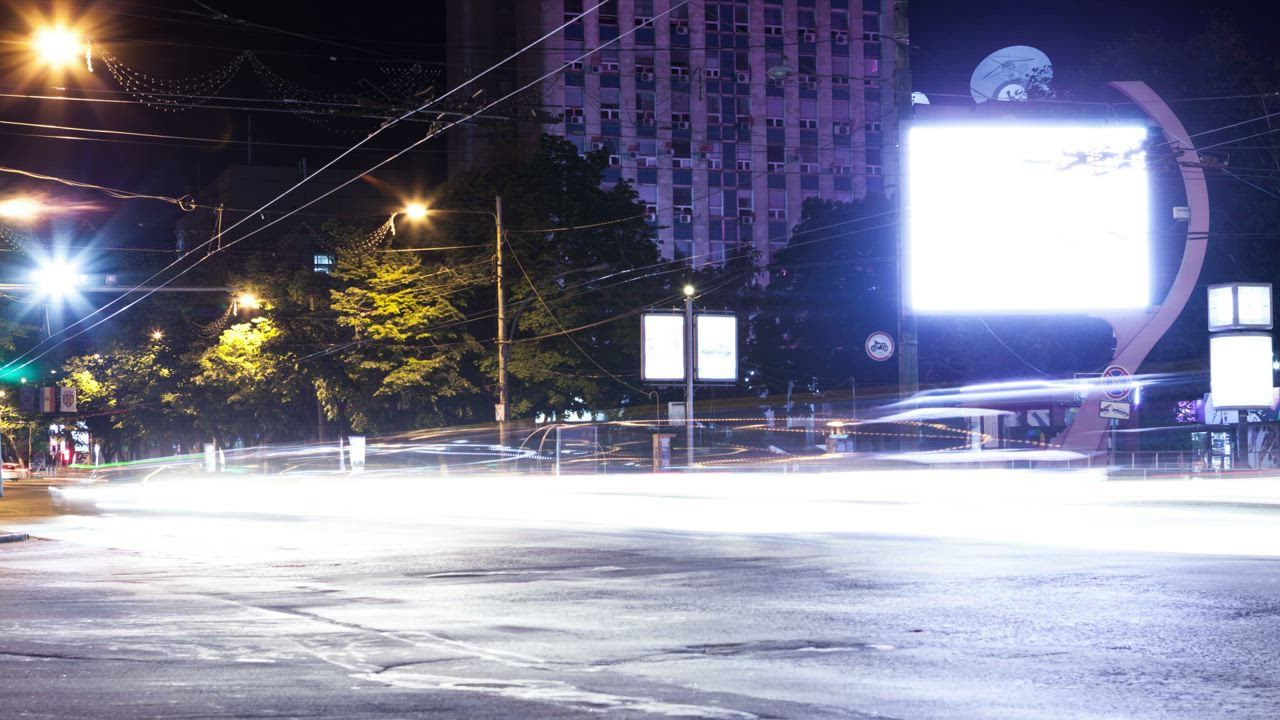 Traffic lights and signs during the night - Free Stock Video