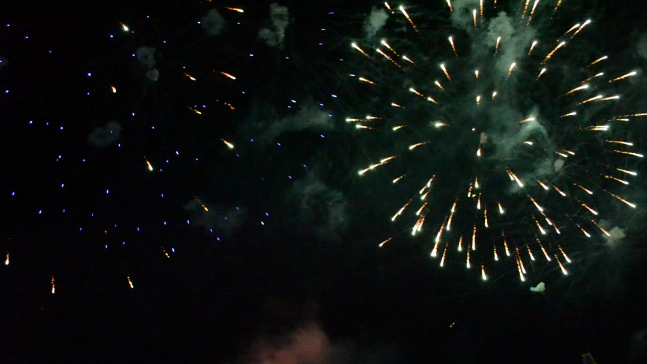 Colorful fireworks exploding at night - Free Stock Video