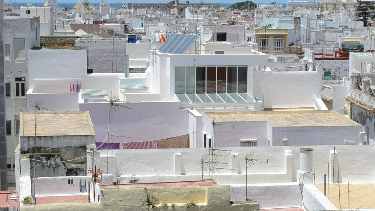 Rooftops leading to the ocean - Free Stock Video