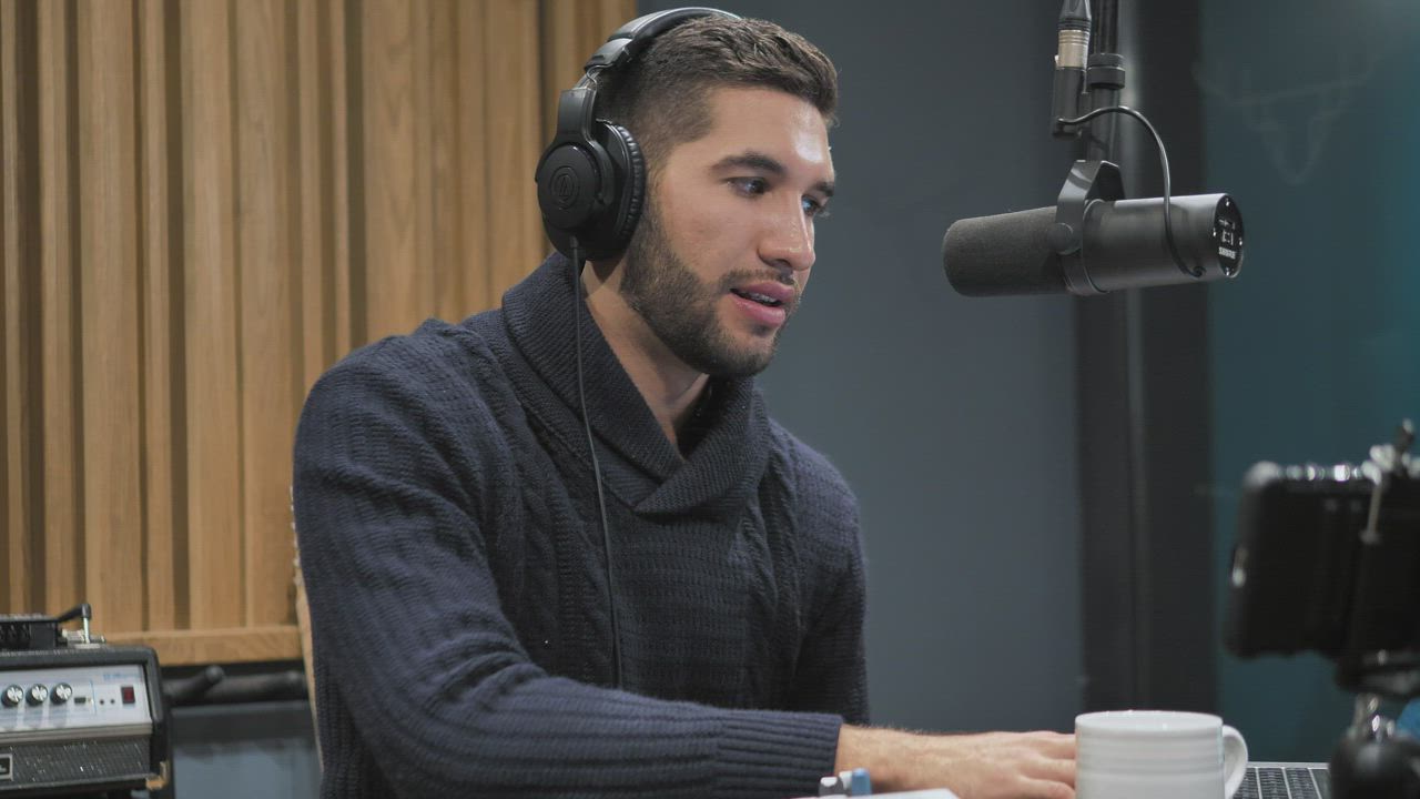 Man speaking into the microphone at record studio - Free Stock Video