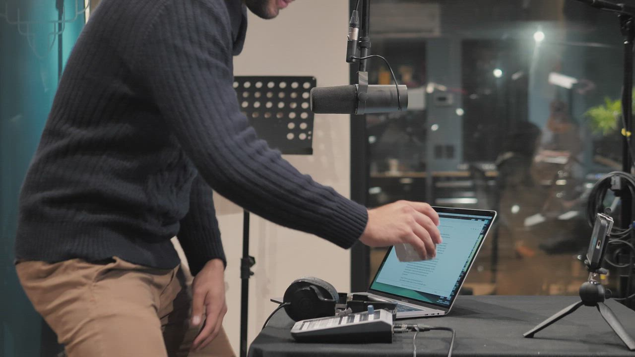 Broadcaster prepares to record program - Free Stock Video