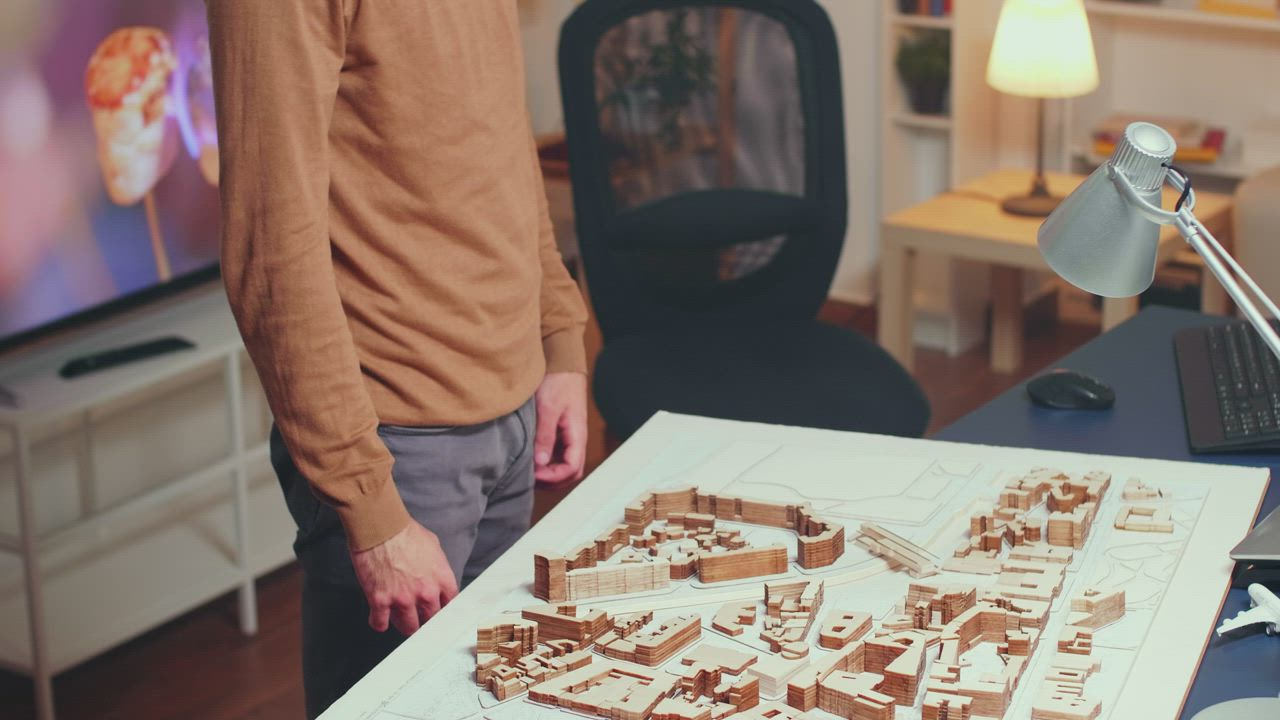Architect working with a model at home - Free Stock Video